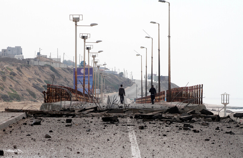 In photos: Palestinians in Gaza celebrate victory, mourn those lost ...