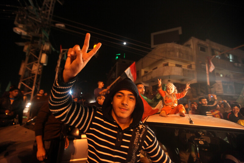 In photos: Palestinians in Gaza celebrate victory, mourn those lost ...