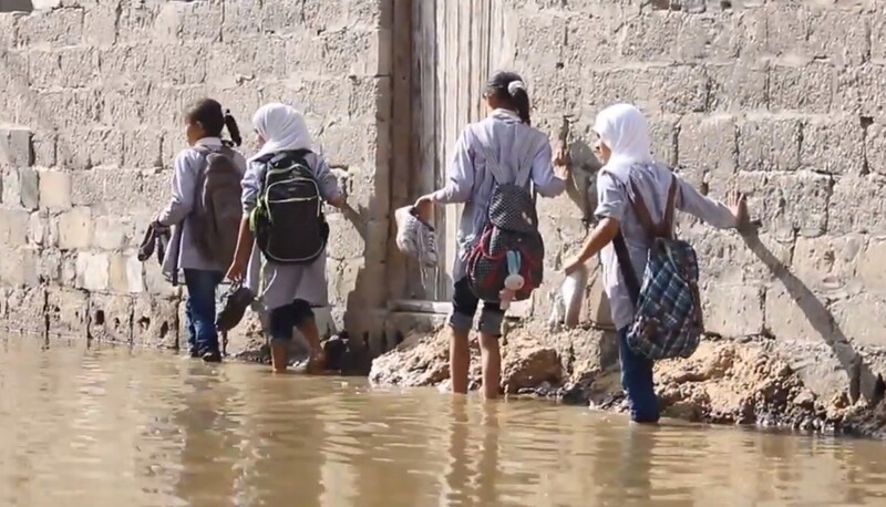 Video: As siege stops pumps, Gaza children wade to school in sewage ...